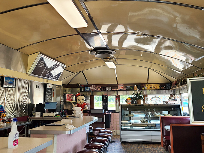 Step inside and the curved ceiling, counter seating, and nostalgic decor transport you to a simpler time when conversations flowed as freely as the coffee.
