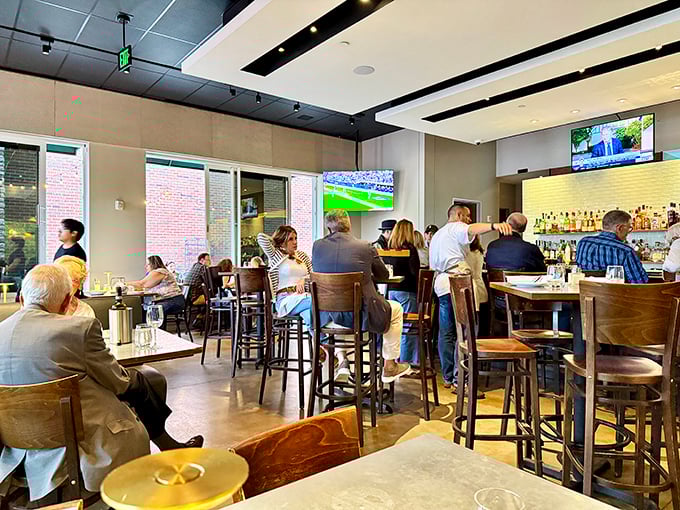 The bar area buzzes with energy as patrons gather to watch games, sip wine, and debate the proper pronunciation of "bruschetta." Spoiler alert: it's "broo-SKET-ta."