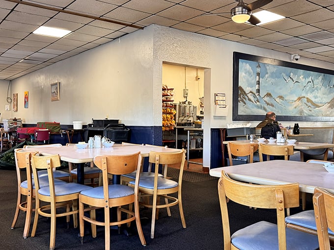 This dining room proves that fancy chandeliers never made pancakes taste better – fluorescent lights work just fine.