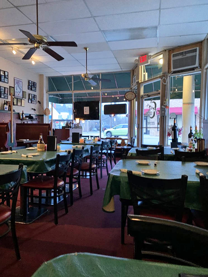 Inside, time stands still with ceiling fans whirring above green tablecloths. This isn't Instagram-bait décor; it's the real deal—a place where memories are made between bites.