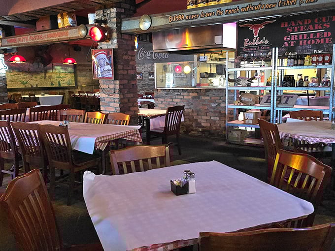 Classic roadhouse charm at its finest – wooden tables, checkered tablecloths, and brick walls that could tell stories if they could talk. This is comfort defined.
