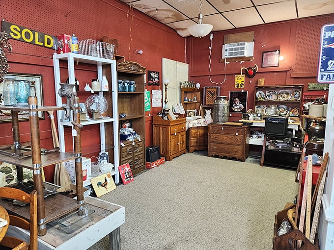 Red walls create the perfect backdrop for antique wooden treasures. That "SOLD" sign is both heartbreak for latecomers and motivation to act fast.