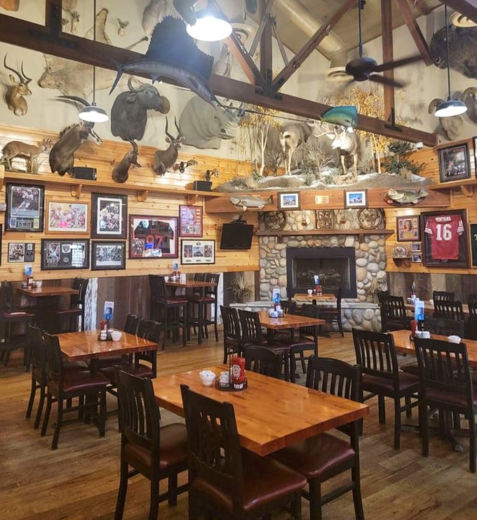 Where wild game meets wild appetites. The dining room's impressive collection of mounted trophies watches over patrons enjoying hearty meals beneath wooden beams.