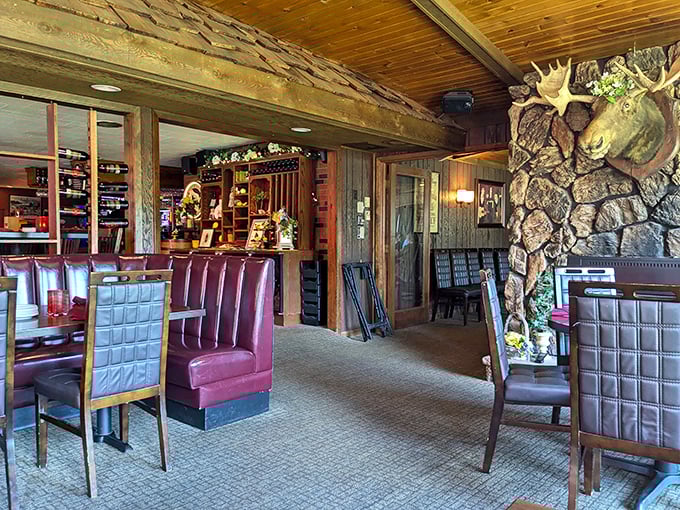 The interior strikes that perfect Northwoods balance—rustic enough to feel authentic, refined enough to make dinner feel like an occasion worth the drive.