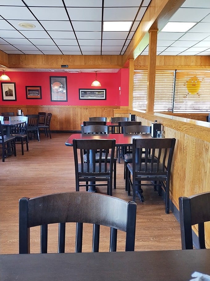 Wood paneling and red walls create the perfect backdrop for burger bliss. This isn't trendy décor—it's timeless comfort.