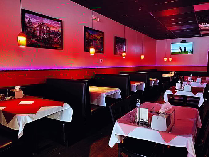 Step inside to a world where red-hued lighting and checkered tablecloths create the perfect backdrop for the serious business of pizza appreciation.