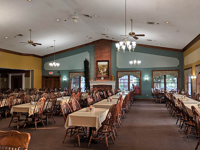 Step inside to a dining room where time slows down—Windsor chairs, warm wood tones, and a central fireplace create the perfect backdrop for conversations that linger as long as the meals. 