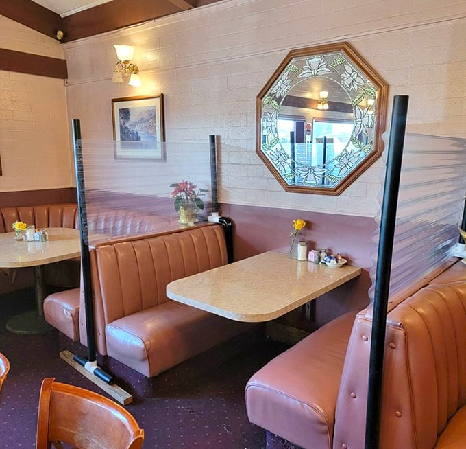 Those salmon-colored booths aren't just seating—they're time machines to when conversation mattered more than Instagram likes.