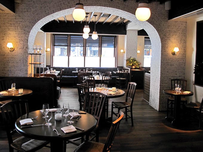 Step inside and the restaurant reveals its charm – exposed brick, warm lighting, and an archway that practically whispers "come, sit, stay awhile."