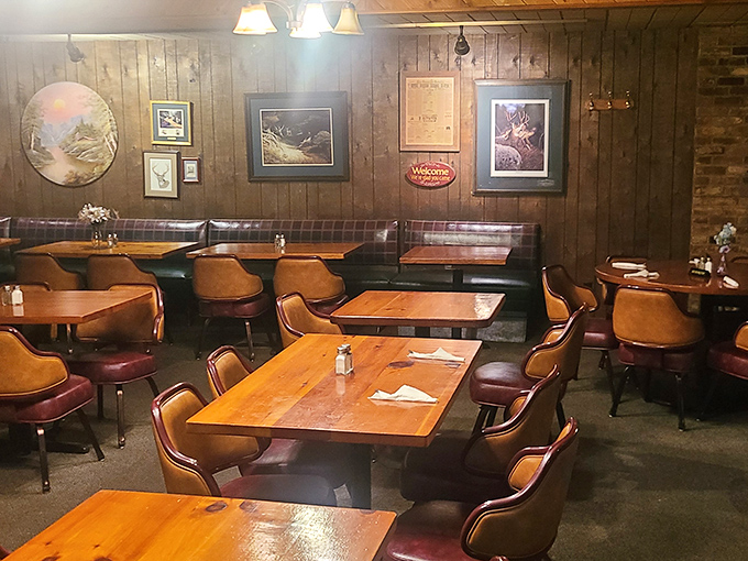 Wood-paneled walls adorned with rustic artwork create the perfect backdrop for serious eating—like dining in your outdoorsy uncle's living room, if he could cook.