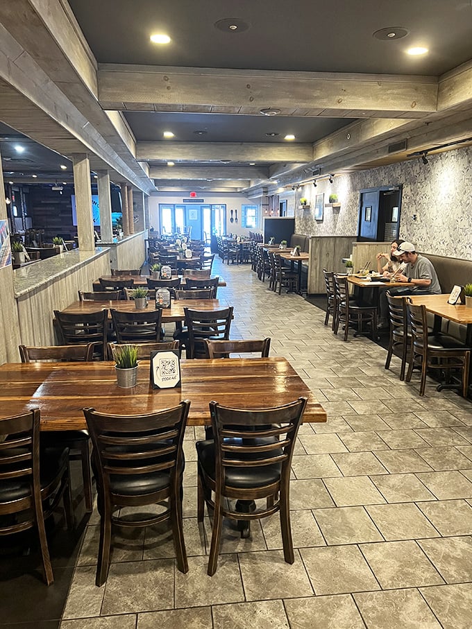 Wooden beams, warm lighting, and tables that invite lingering conversations—this dining room knows the secret ingredient to hospitality is making you feel at home.