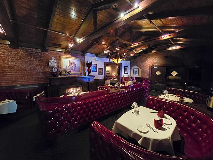 Red leather booths cradle diners beneath exposed wooden beams, creating the perfect atmosphere for important decisions—like medium-rare or rare.