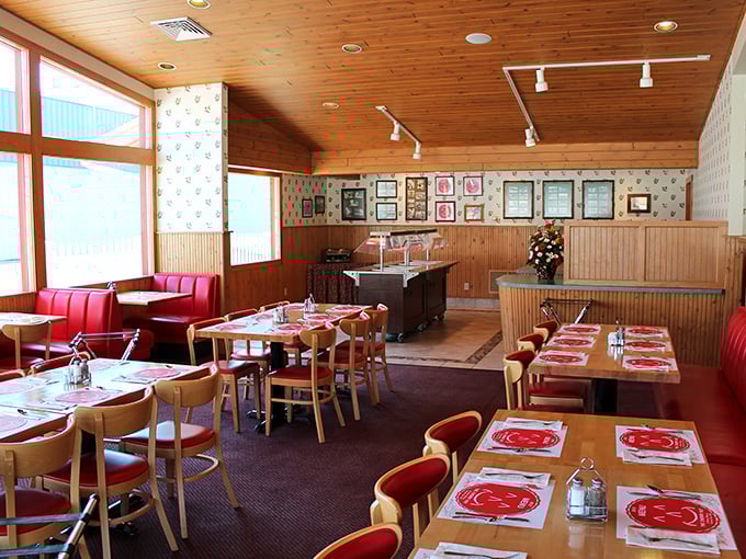 Wood-paneled walls, red vinyl booths, and cherry-themed placemats—this isn't just nostalgic design, it's time travel with table service.