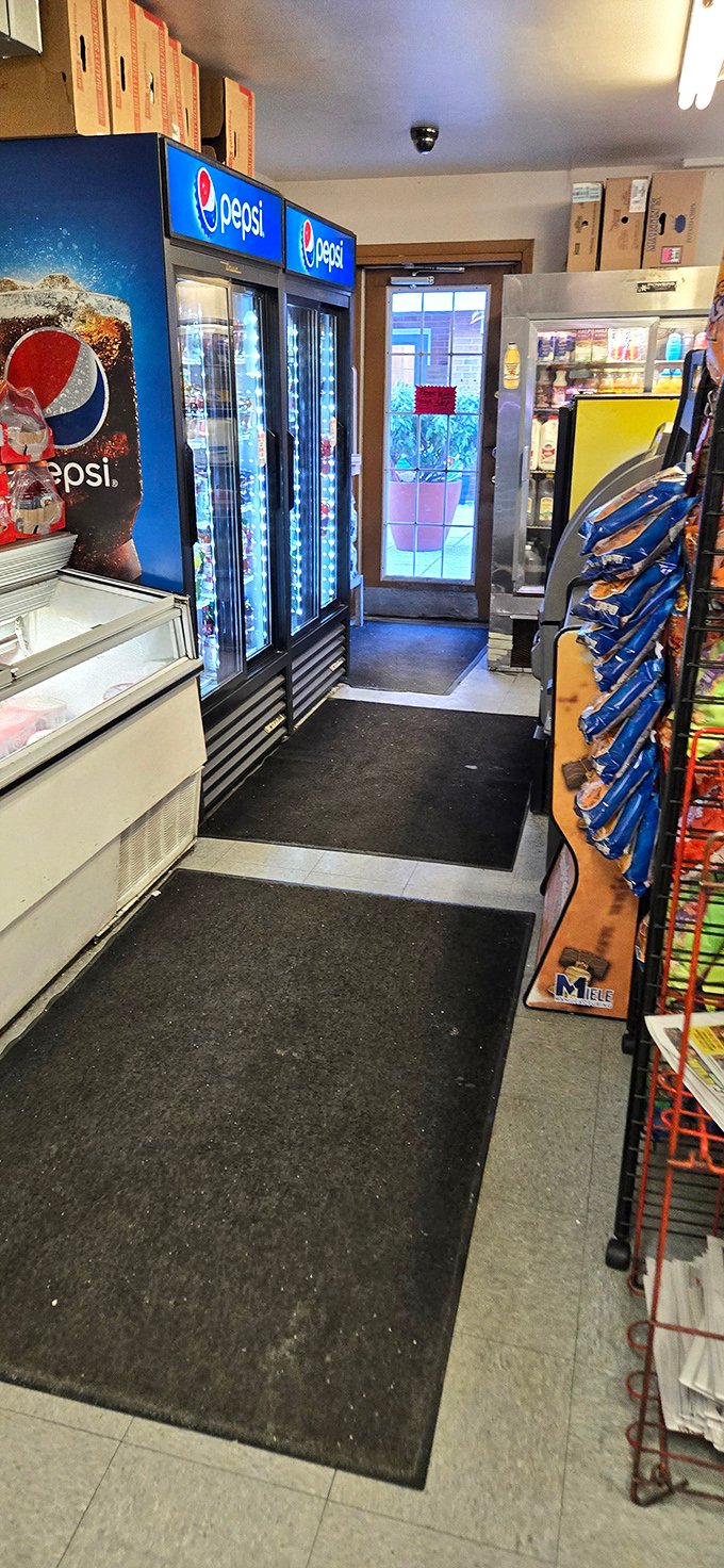 Inside, it's all business – refrigerated cases and snack racks line the walls in this temple of sandwich craftsmanship.