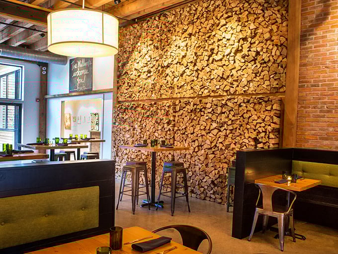 Industrial chic meets cozy comfort in this stunning space where exposed beams frame unforgettable dining experiences.