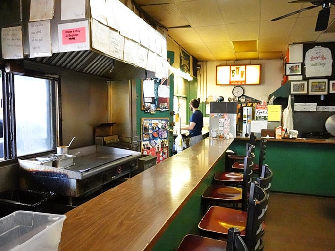 Inside, the no-frills counter and classic spinning stools tell you everything you need to know—they're focused on the pizza, not the décor. 