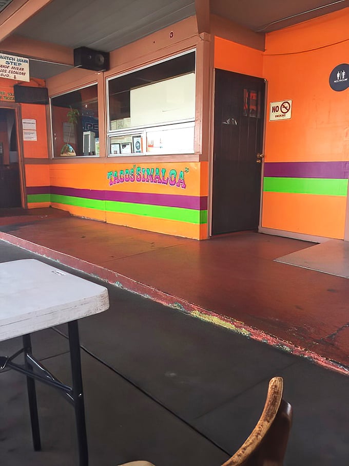The colorful interior matches the bold flavors you'll find inside. Orange walls with festive stripes—like the restaurant equivalent of a happy mariachi band.