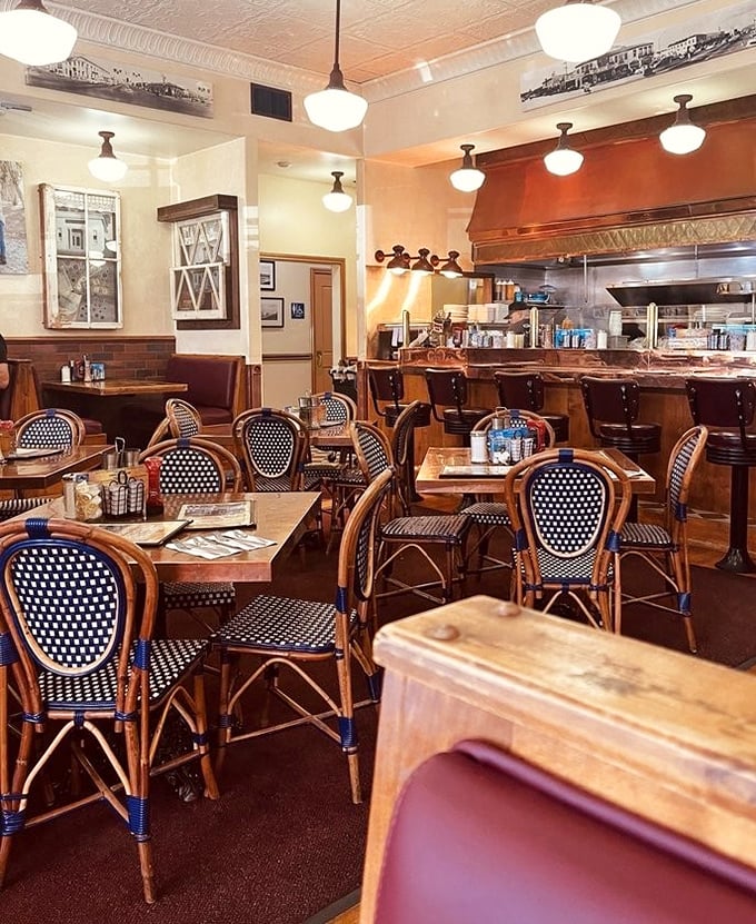 Bistro chairs that could've been plucked from a Parisian sidewalk cafe meet classic American diner vibes. The open kitchen invites you to witness breakfast alchemy in action.