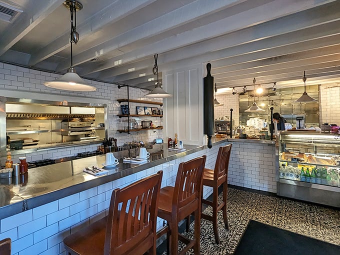 Counter seating: where breakfast voyeurs can witness culinary magic happening just feet away. Those white subway tiles aren't just pretty – they're witnesses to countless perfect omelettes.