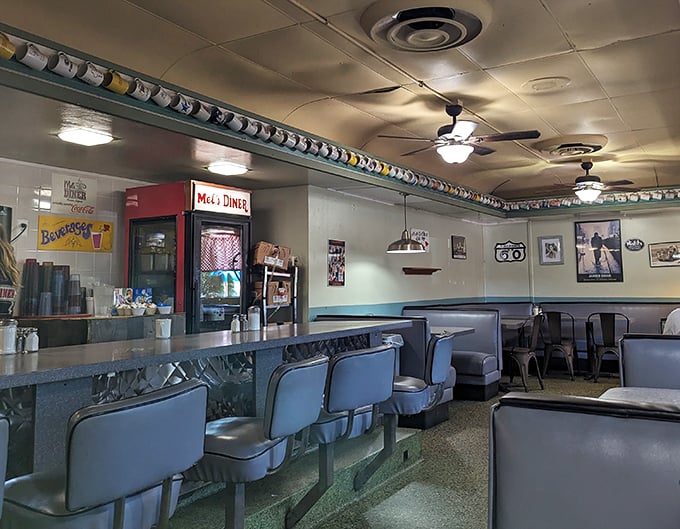 Step inside and you're transported to the golden age of diners—where counter stools await your breakfast dreams and mugs line up like soldiers ready for coffee duty.