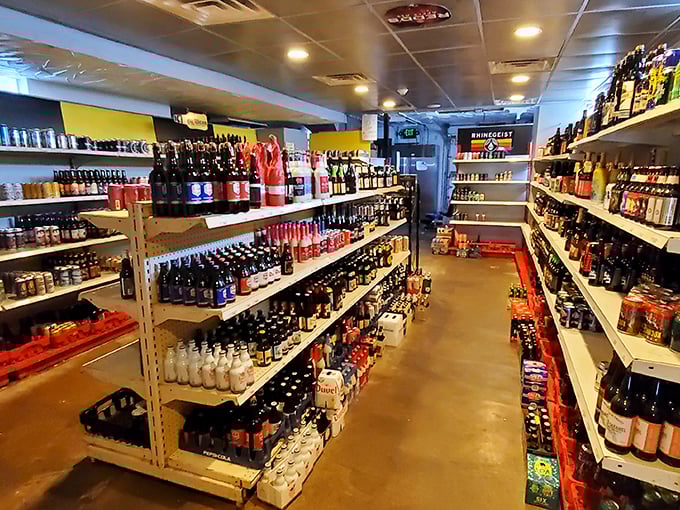 The legendary "beer cave" – where hundreds of bottles stand in formation like a delicious army awaiting your selection. Decision paralysis has never been so rewarding.