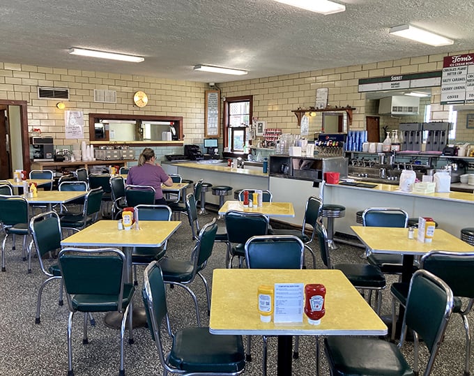 Classic Americana at its finest—yellow Formica tables, blue chairs, and the promise of ice cream perfection. Nostalgia never tasted so good.