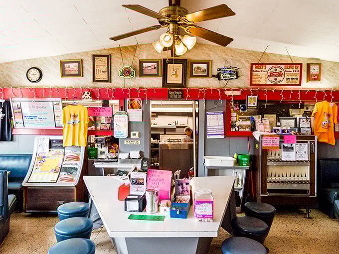 Step inside and the nostalgia hits harder than your hunger—checkered curtains, vintage memorabilia, and the promise of satisfaction await.