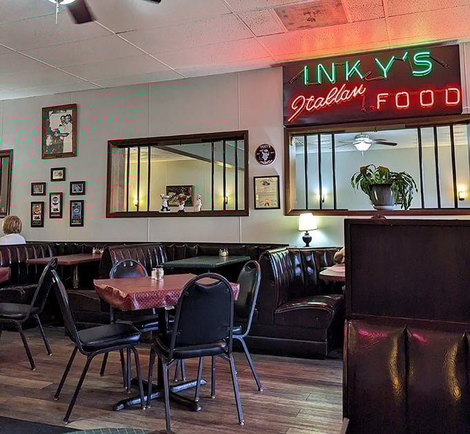 The interior's vintage charm feels like stepping into your Italian grandmother's dining room—if your grandmother had amazing neon signage.