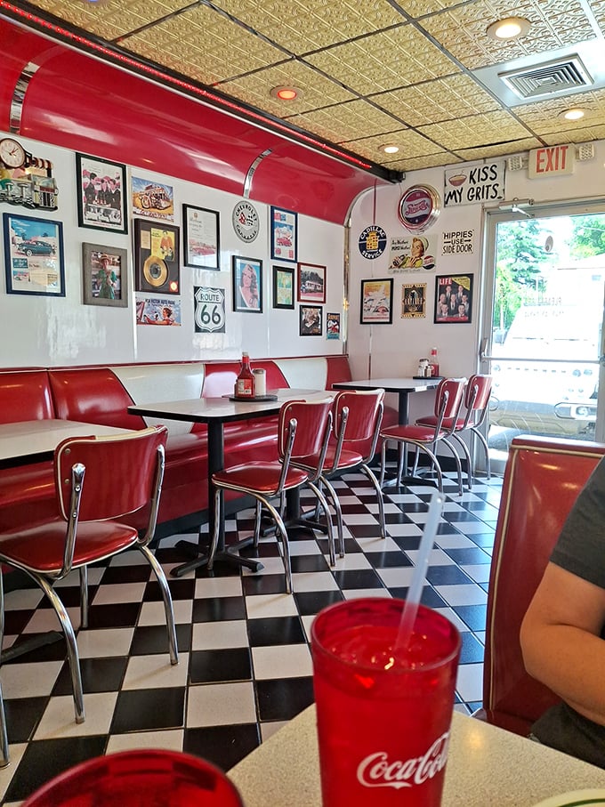 Classic red vinyl booths, checkerboard floors, and walls adorned with Route 66 memorabilia—this isn't retro-themed, folks, it's the real nostalgic deal that never went out of style.