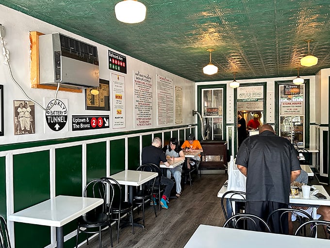 Step inside to a world where time slows down—mint green ceiling, classic New York memorabilia, and simple tables that have hosted thousands of satisfied diners.