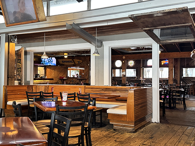 The rustic interior feels like it's been shaped by decades of sea breezes, with wooden booths that have witnessed countless vacation stories unfold.