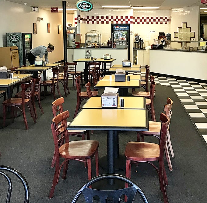 Classic black and white checkered floors set the stage for sandwich artistry—no fancy frills, just delicious fundamentals done right.