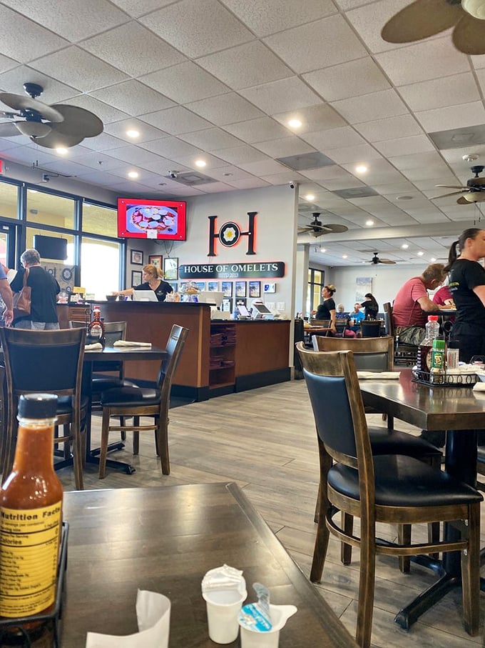 Clean lines, comfortable booths, and ceiling fans spinning lazy circles – this is breakfast without the theatrical nonsense.