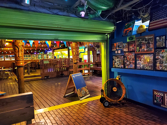 Tiki posts stand guard like wooden sentinels of good times. The interior blends Caribbean charm with Florida kitsch in the most delightful way possible.
