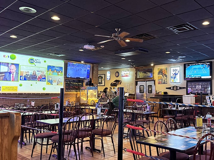 Where sports dreams and culinary magic collide – Dino's dining room stands ready for the dinner rush, TVs poised for the big game.