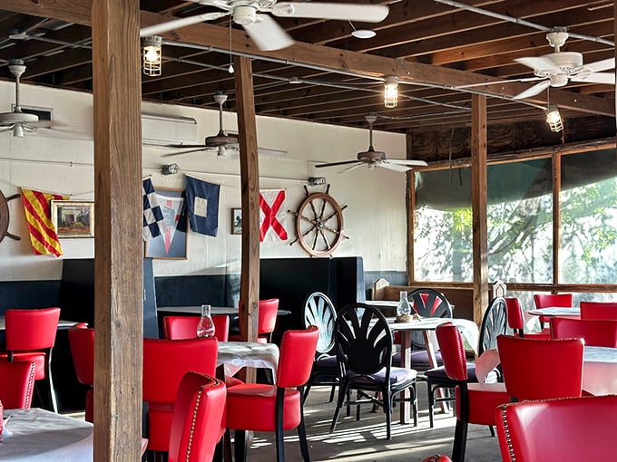 Nautical flags and ship wheels aren't just decor here – they're a promise that you're about to enjoy seafood prepared by people who understand the sea.