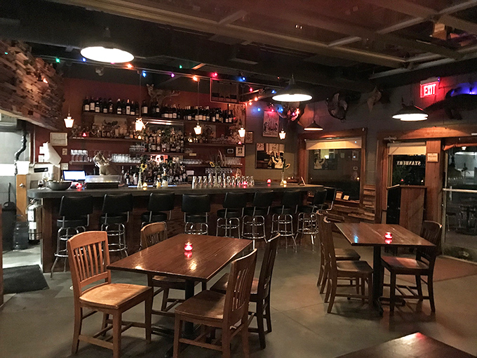 Where rustic meets refined—wooden tables, mounted deer heads, and a well-stocked bar create the perfect backdrop for food that's anything but ordinary.