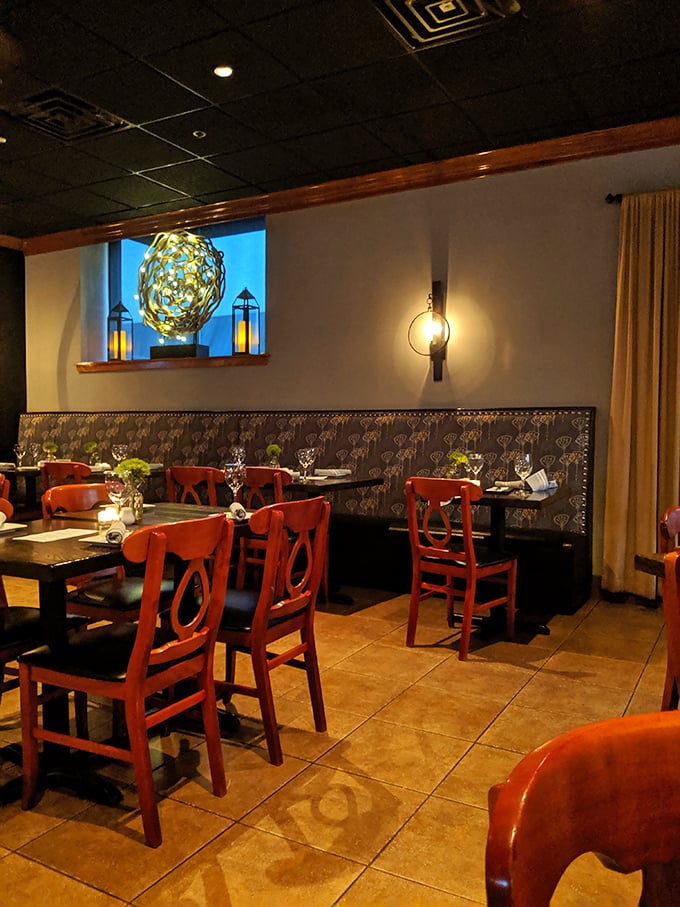Those vibrant red chairs aren't just a design choice – they're a promise that what happens at your table will be anything but boring.