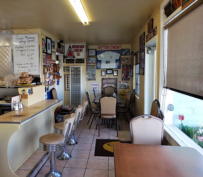 Inside, every inch of wall space tells a story – vintage signs, memorabilia, and photographs create a museum of Americana where breakfast tastes better.