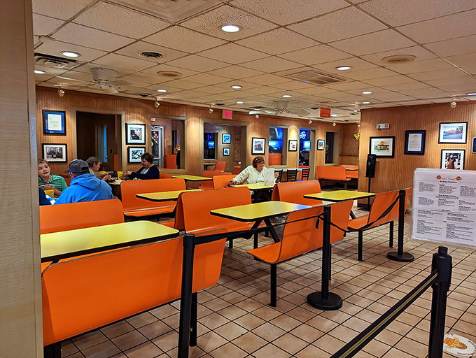 Orange booths aren't just seating—they're front-row tickets to the greatest meat show in Virginia.