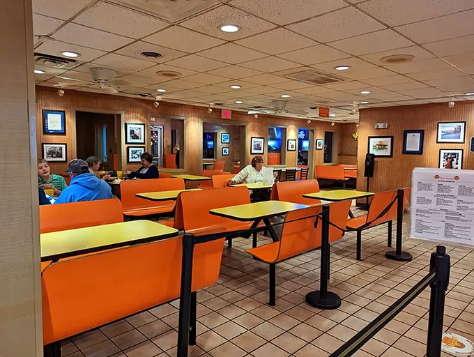 Orange booths aren't just seating—they're front-row tickets to the greatest meat show in Virginia.