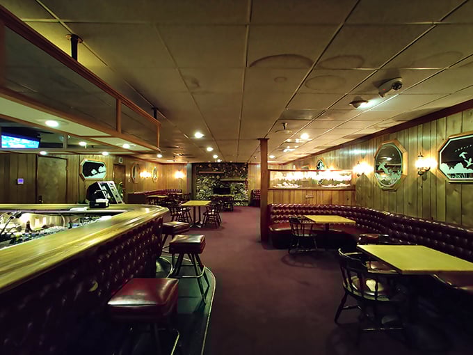 Step inside and time stands still. Wood paneling, red leather booths, and that unmistakable steakhouse ambiance—like walking into a delicious time capsule.