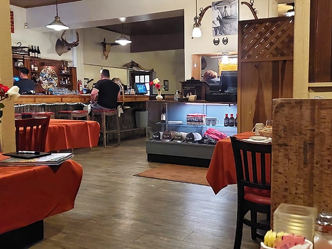 Step inside and you're transported to a simpler time—red tablecloths, Western decor, and the intoxicating aroma of oak-fired grills that makes waiting for your table a pleasure, not a chore.