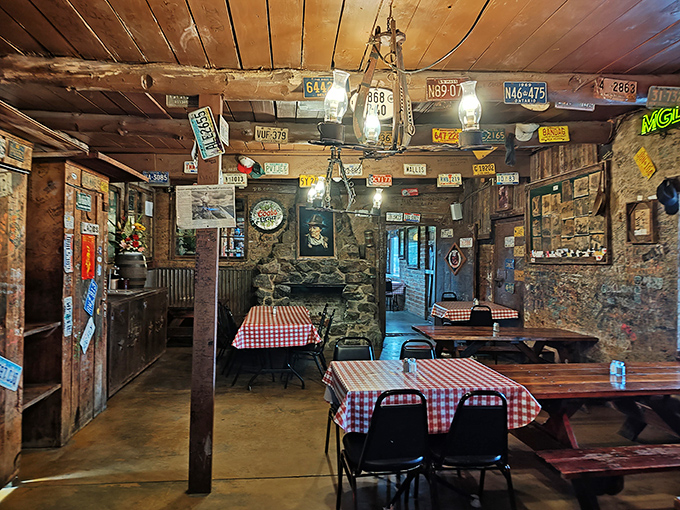 License plates from every corner of America adorn walls that have witnessed decades of satisfied sighs. Red checkered tablecloths aren't trendy—they're timeless.
