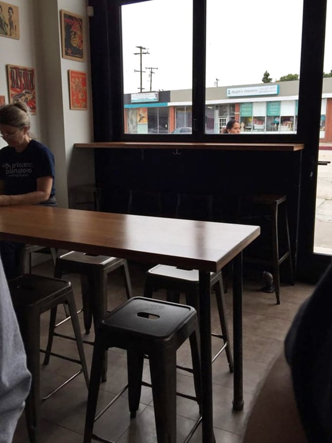 Industrial-chic meets cozy corner – the perfect setting for food that demands your full, undivided attention.