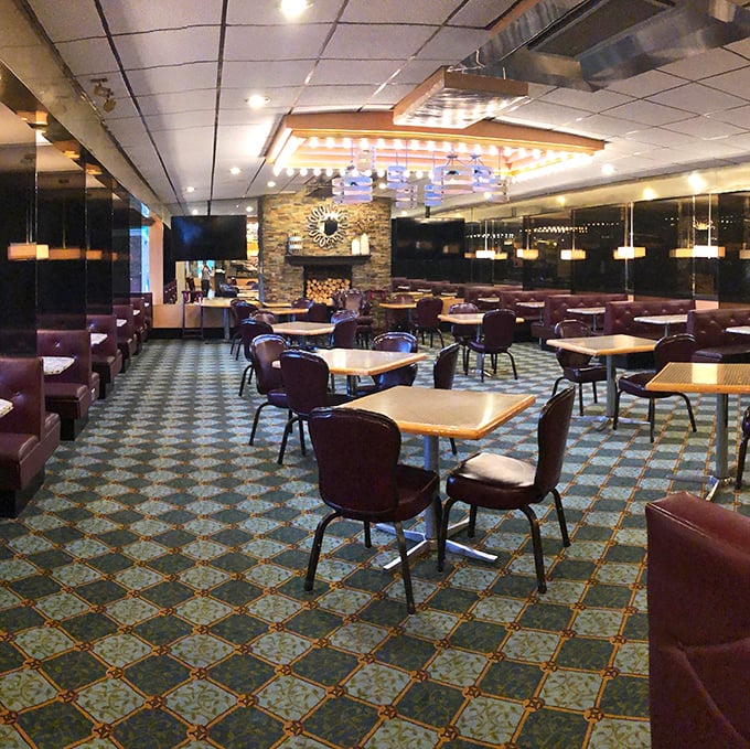 Step inside and you're greeted by that perfect diner ambiance—burgundy booths, patterned carpet, and lighting that makes everyone look like they're ready for dessert.