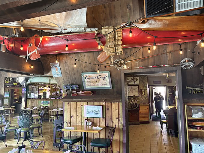 Nautical nostalgia meets culinary comfort under this canoe-adorned ceiling. The Cove's interior feels like stepping into a Great Lakes time capsule, strings of lights included.
