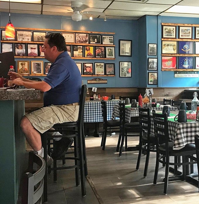 Blue walls adorned with decades of Pittsburgh memories create the perfect backdrop for serious breakfast contemplation at the counter.