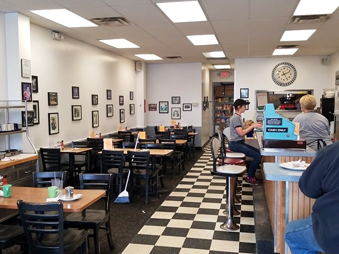 Classic checkered floors and photo-lined walls create the perfect backdrop for memorable morning meals.