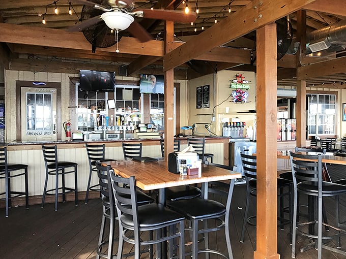 Exposed wooden beams and string lights create that perfect "I've discovered something special" atmosphere. The bar practically whispers, "Stay awhile, the stories are free."